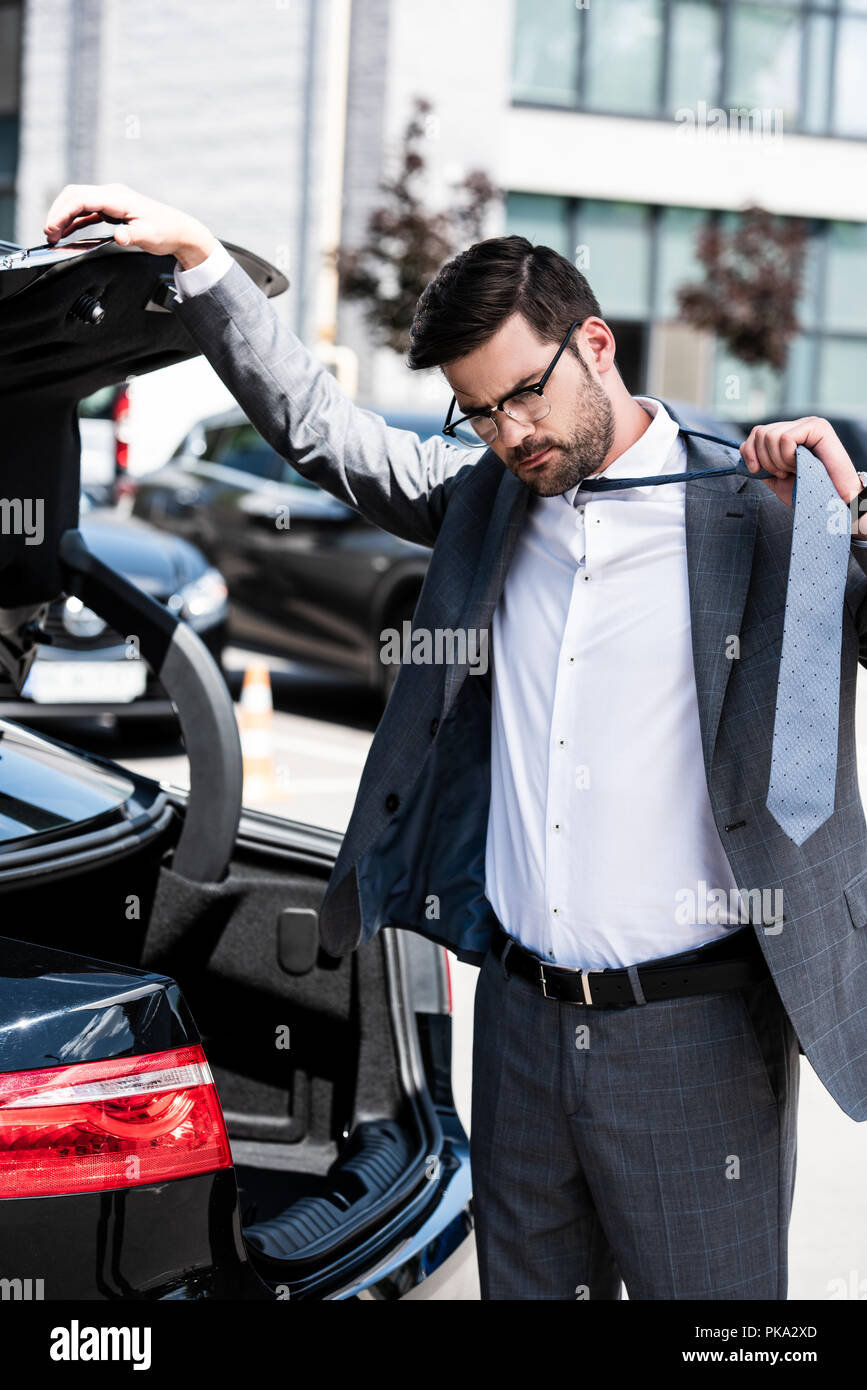 Man closing trunk vehicle hi-res stock photography and images - Alamy