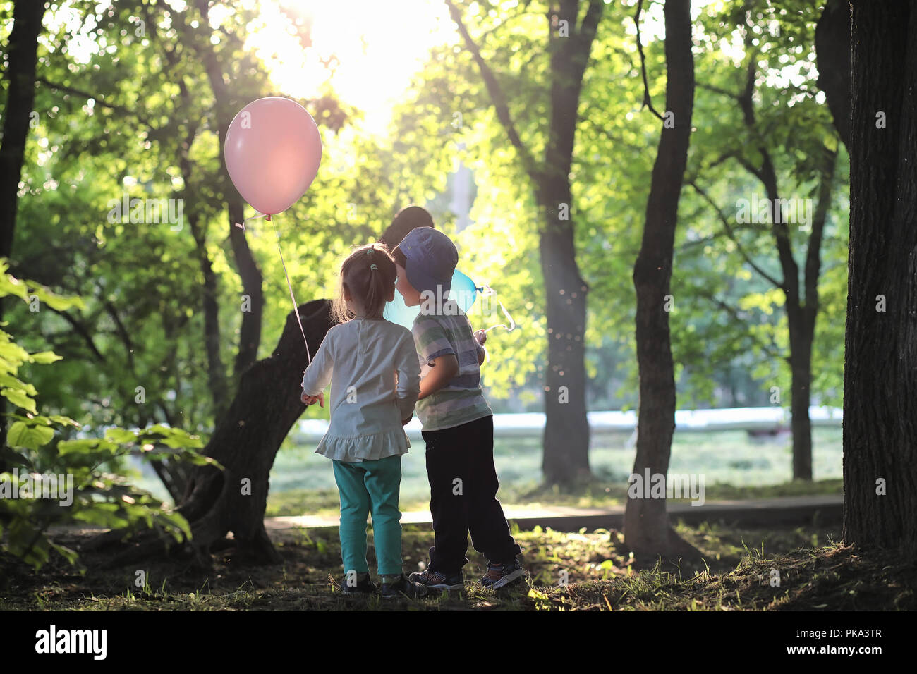 Little children are walking in a park Stock Photo - Alamy
