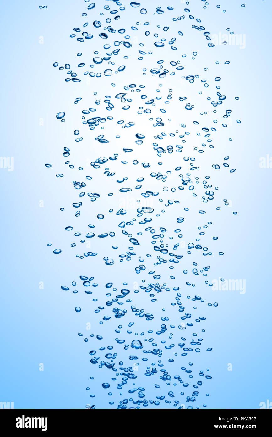 soaring air bubbles in blue water with light effect Stock Photo - Alamy