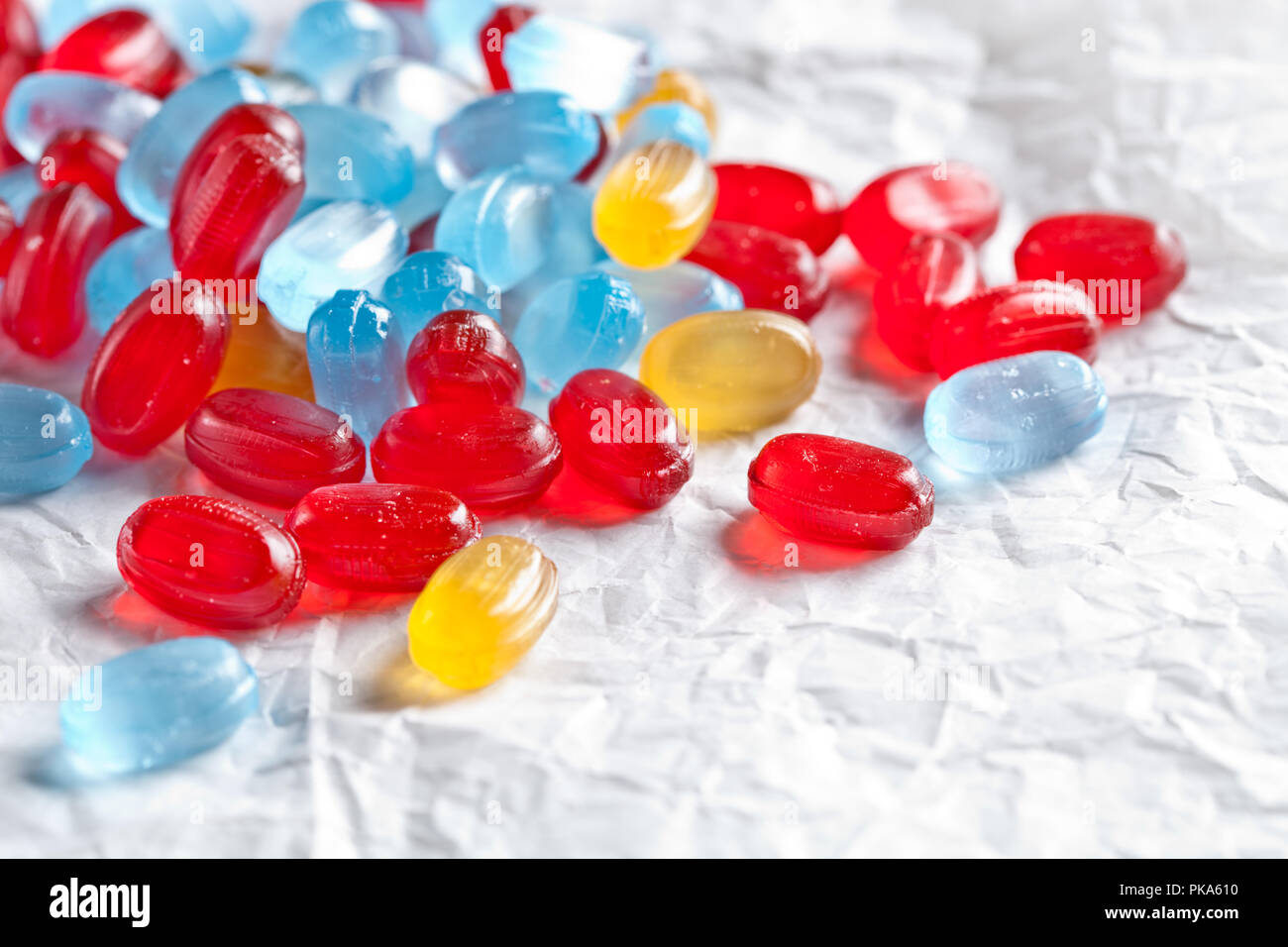 colorful candies closeup on paper background Stock Photo - Alamy