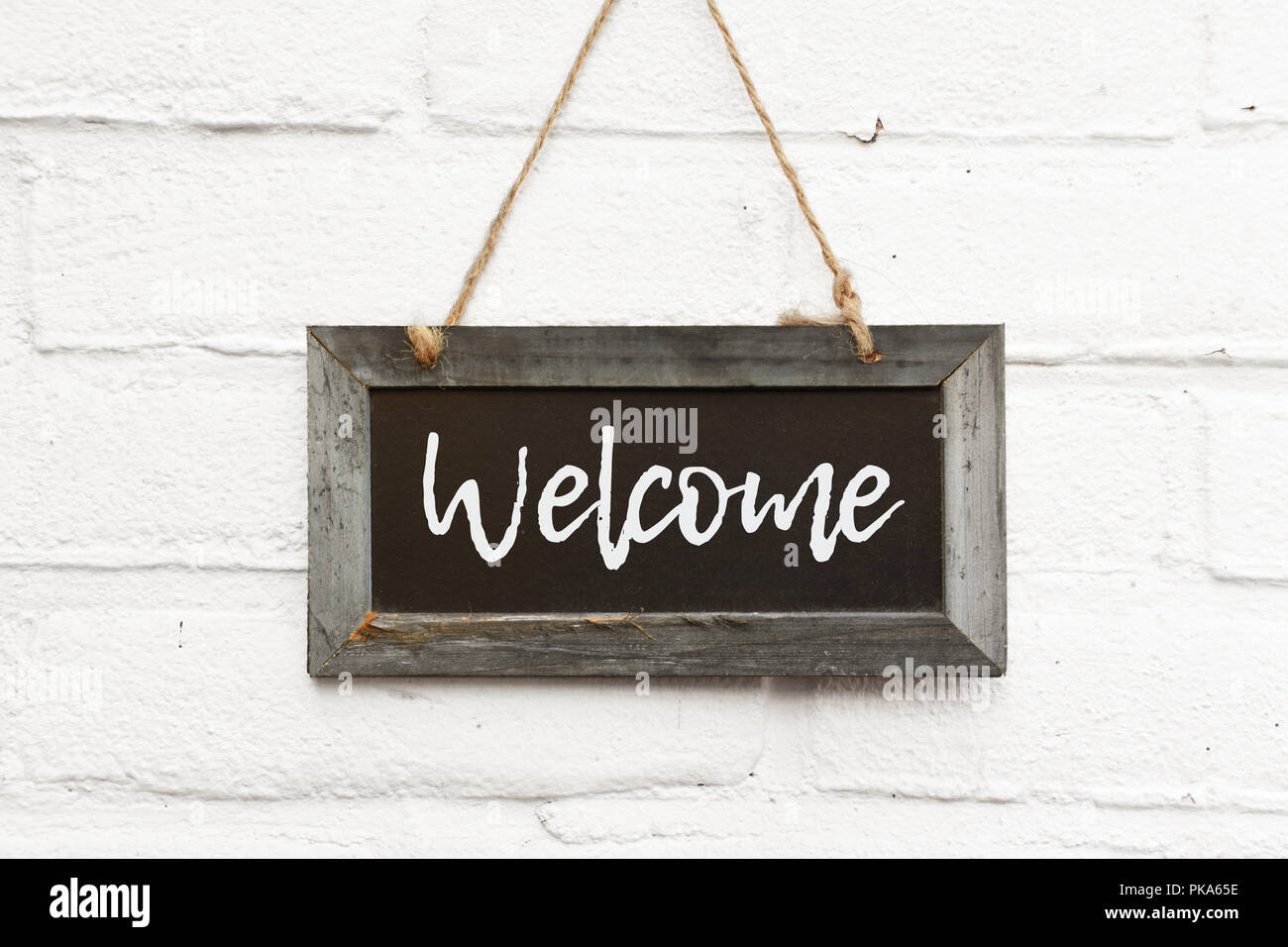 Chalkboard sign board with text welcome come in Stock Photo - Alamy