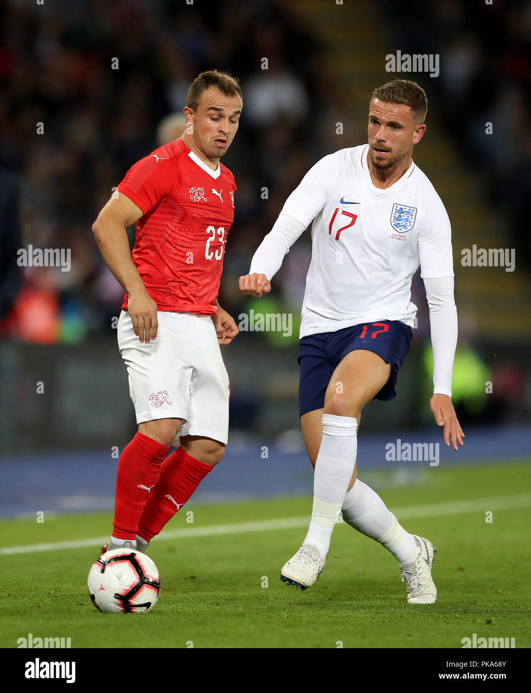 Switzerland's Xherdan Shaqiri (left) and England's Jordan Henderson in ...