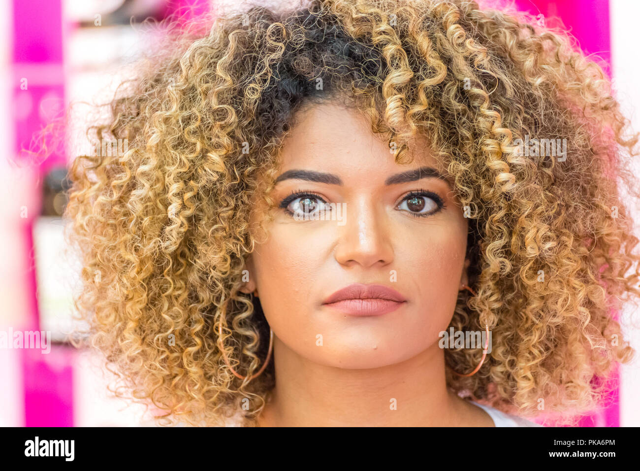 BOLOGNA (ITALY), SEPTEMBER 10, 2018: Booth presenter awaiting visitors ...
