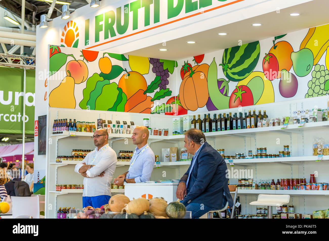 BOLOGNA (ITALY), SEPTEMBER 10, 2018: Booth presenter awaiting visitors ...
