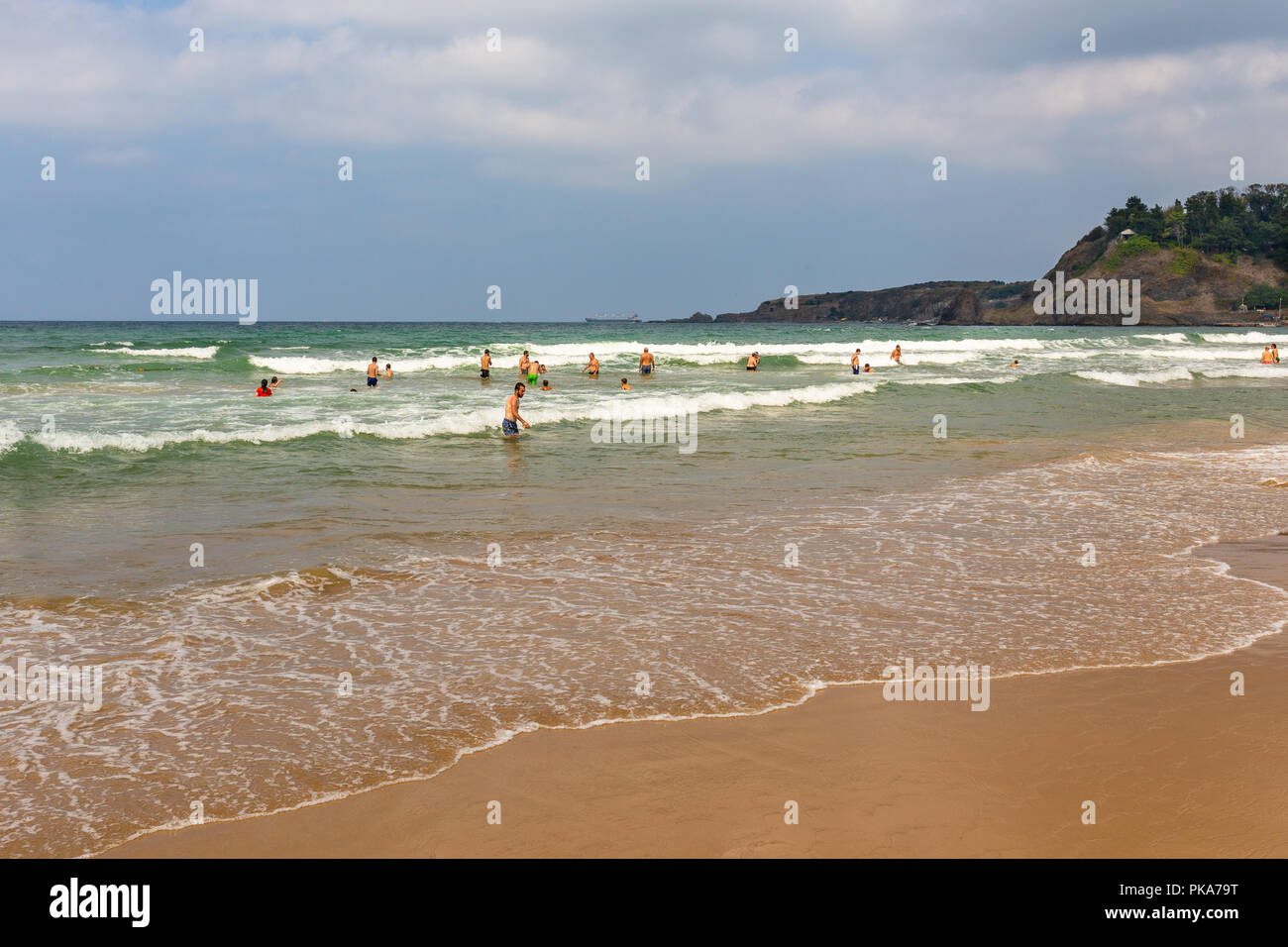 People at kilyos beach. Kilyos, also Kumkoy, is a village located in ...