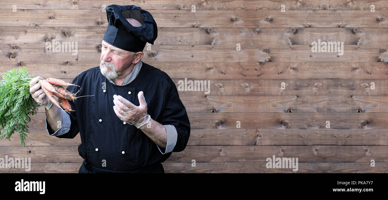 Chef old in uniform with vegetables Stock Photo - Alamy