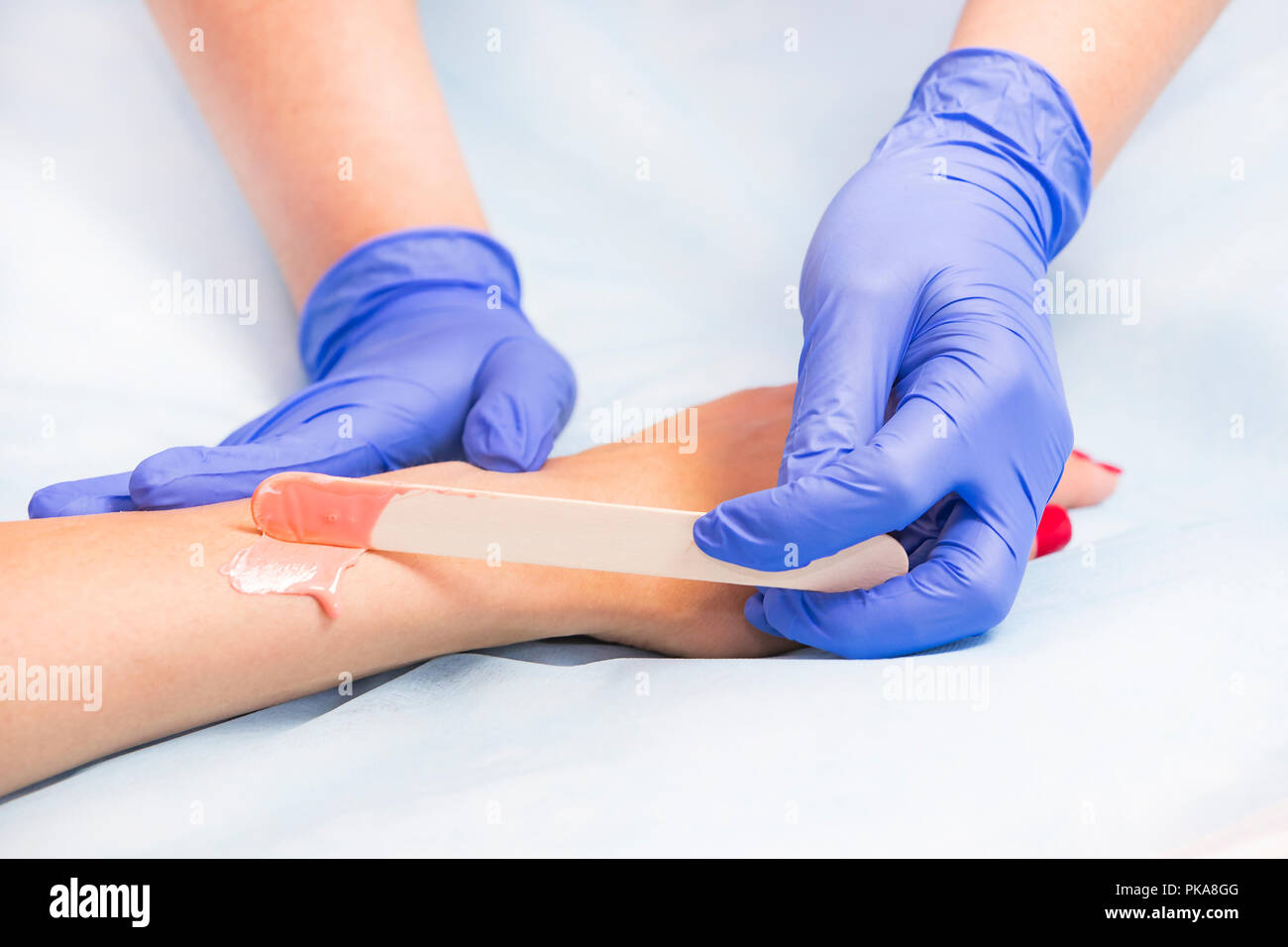 Process depilation female legs and hands in a beauty salon Stock Photo ...