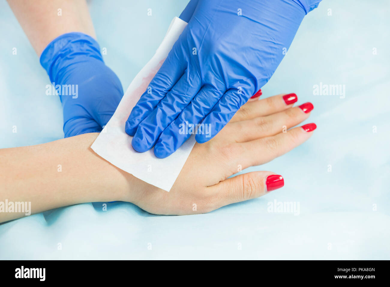 Process depilation female legs and hands in a beauty salon Stock Photo ...