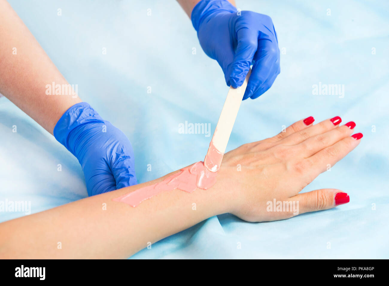 Process depilation female legs and hands in a beauty salon Stock Photo ...