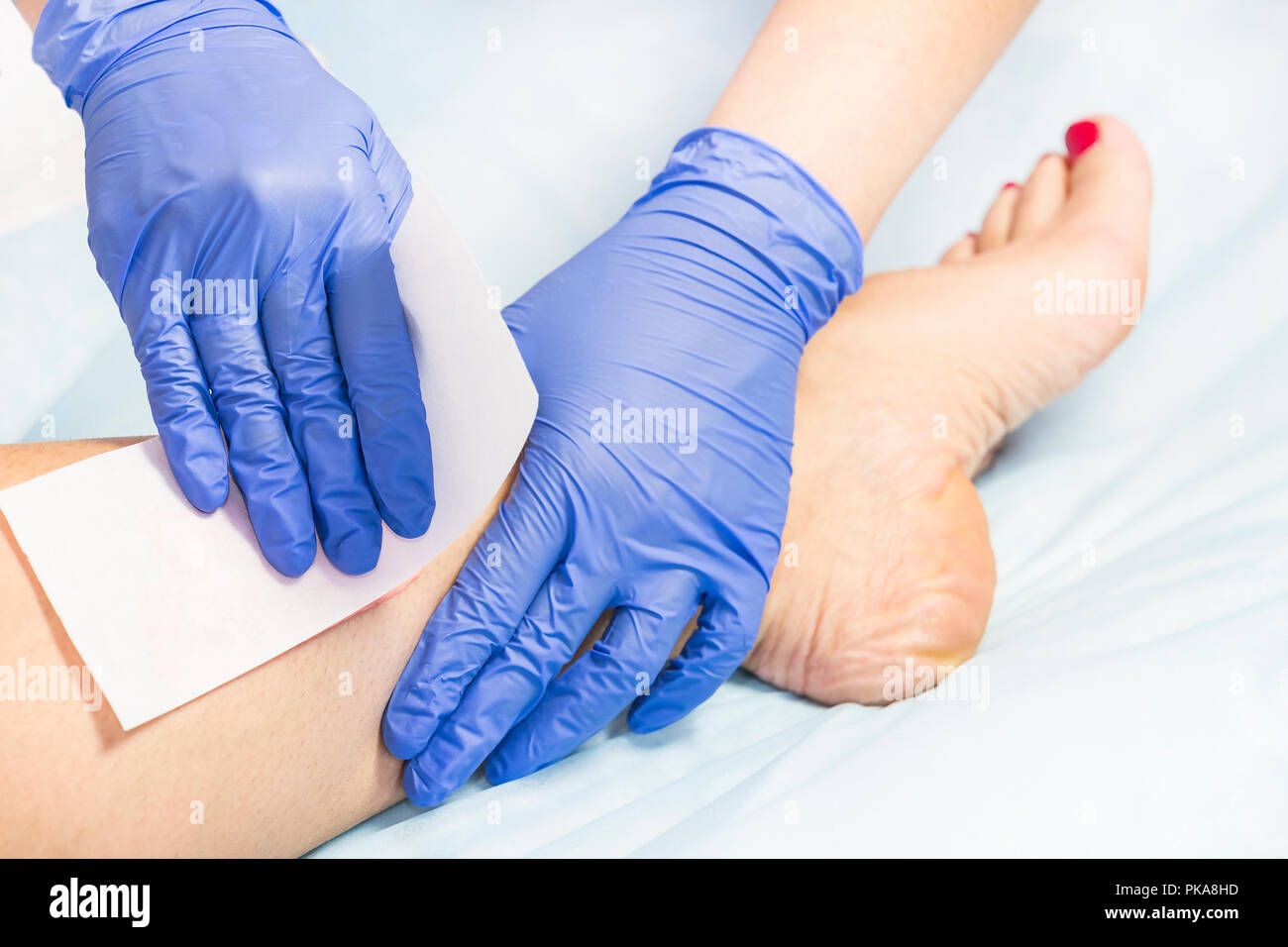 Process depilation female legs and hands in a beauty salon Stock Photo ...