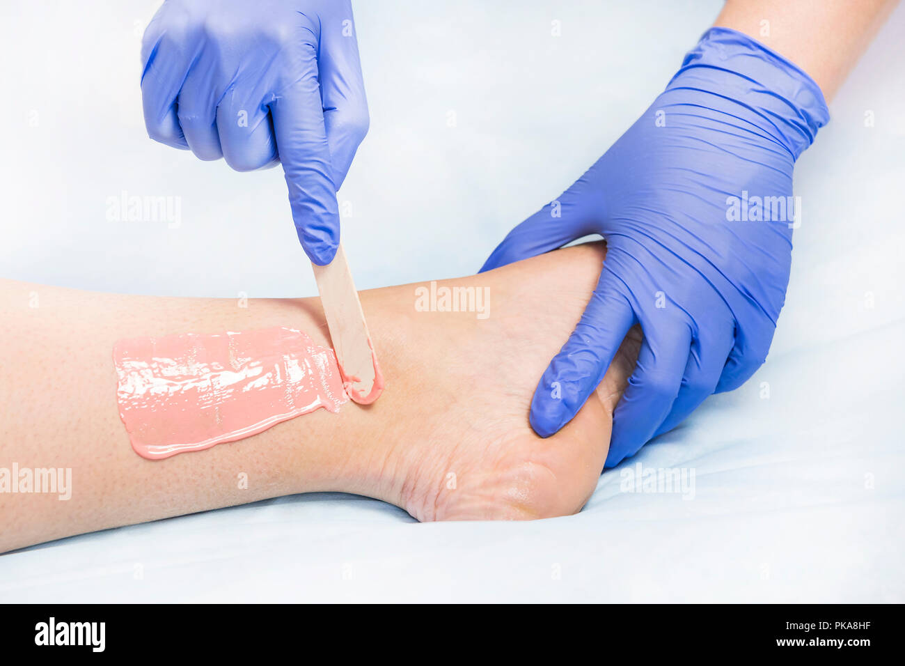 Process depilation female legs and hands in a beauty salon Stock Photo ...