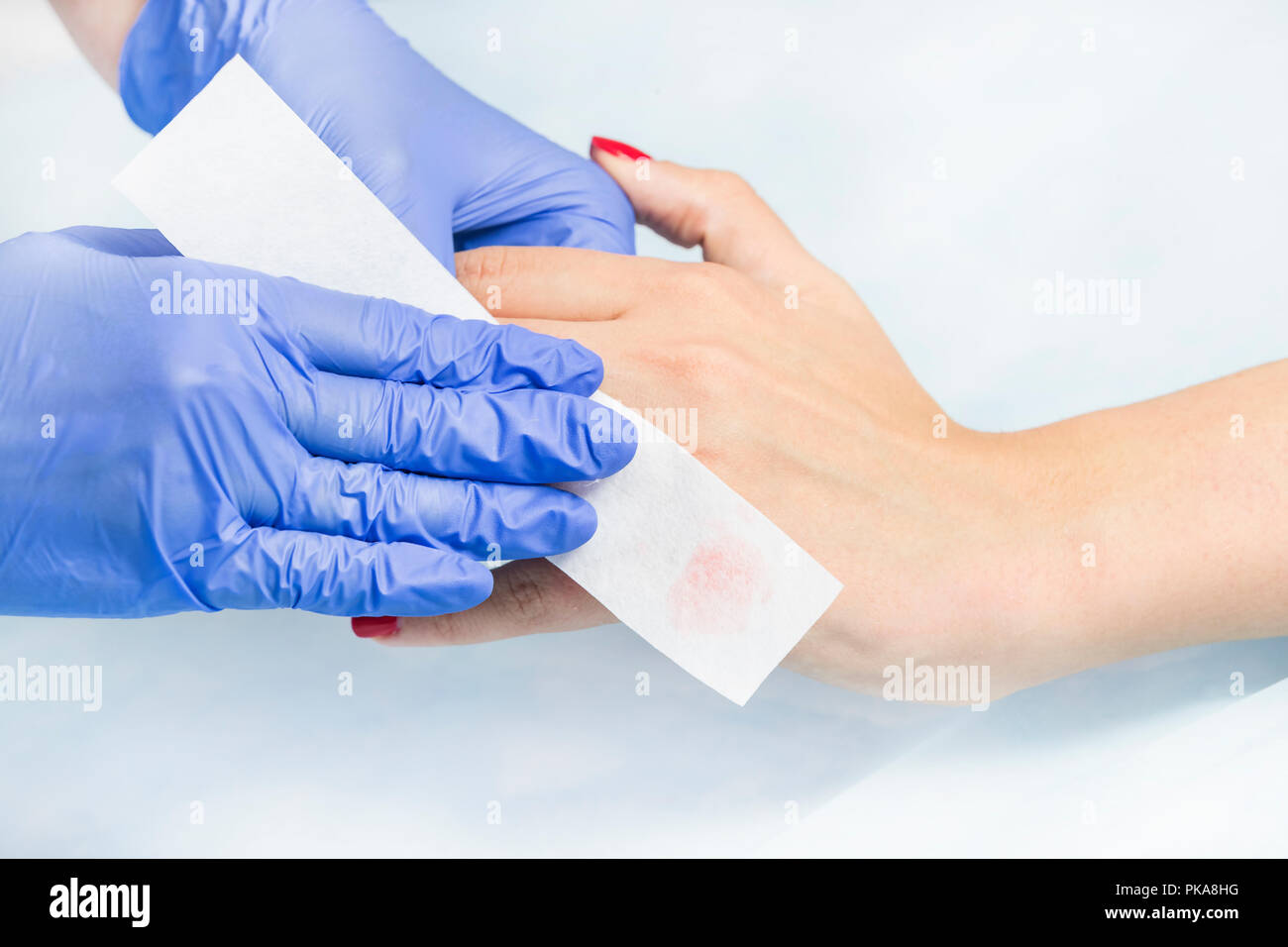 Process depilation female legs and hands in a beauty salon Stock Photo ...