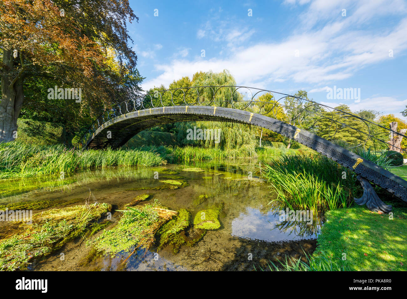 Wrought iron metalwork bridge over the River Itchen, Avington Park, a ...