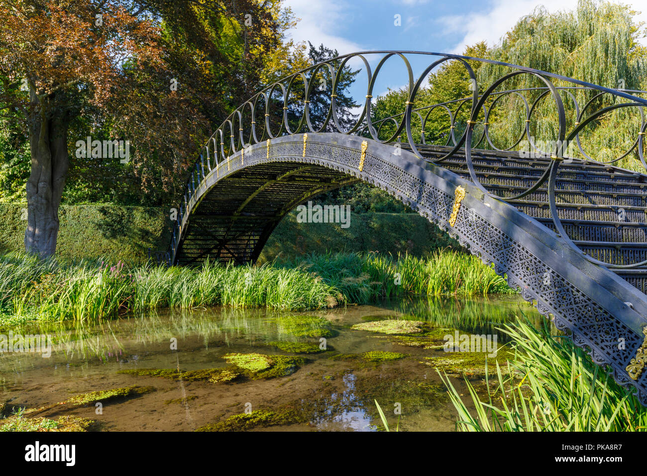 Wrought iron metalwork bridge over the River Itchen, Avington Park, a ...