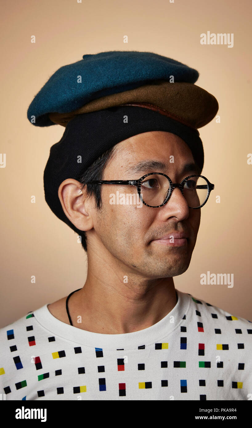 man wears many hats Stock Photo - Alamy