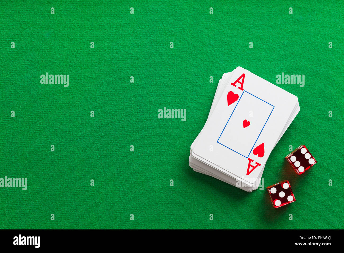 Deck of Playing Cards and Dice on Green Table Stock Photo - Alamy