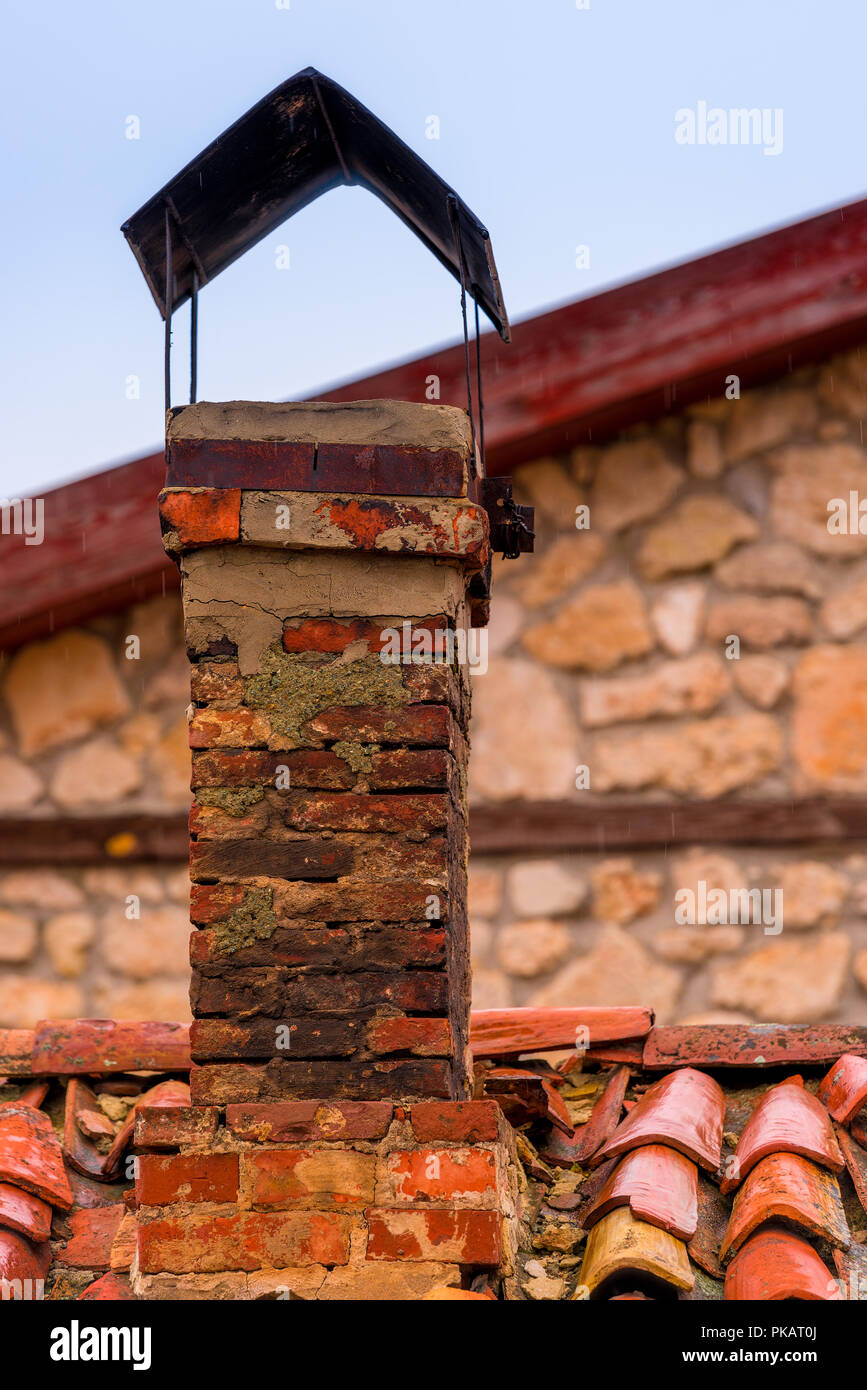 chimney on the roof of a rural house close up Stock Photo - Alamy