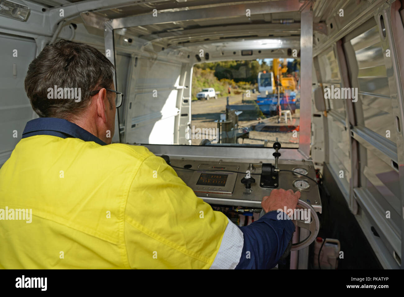 MOANA, NEW ZEALAND, OCTOBER 27, 2017: An oil well engineer works from ...