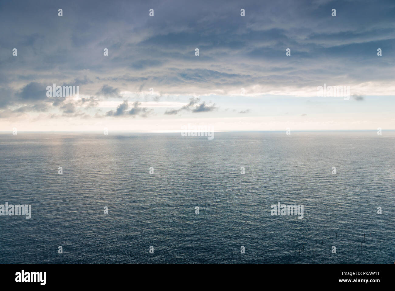 The surface of the sea with a slight ripple, a view of the horizon and ...