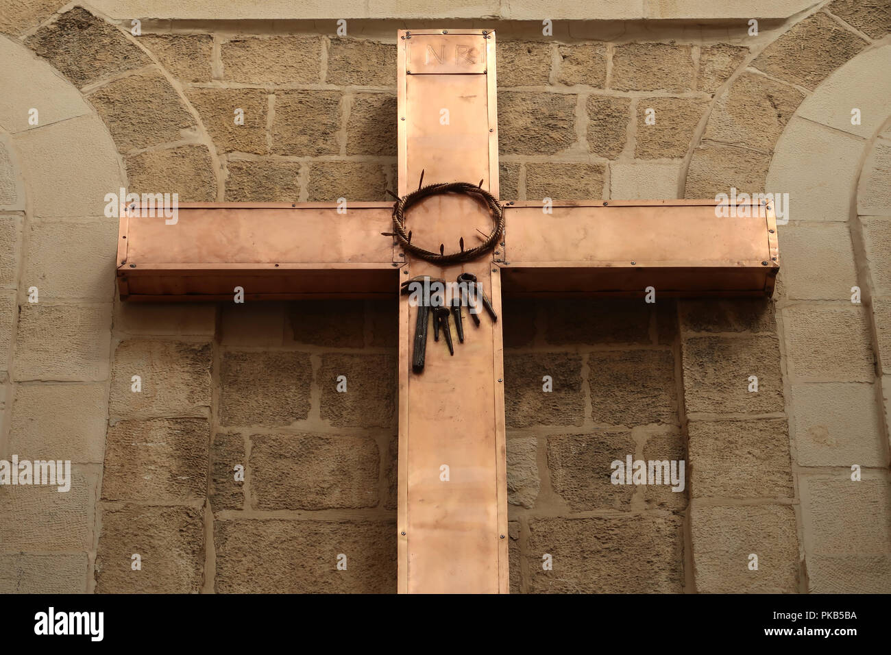 A cross placed at the inner courtyard of the Mar Maron house and the ...