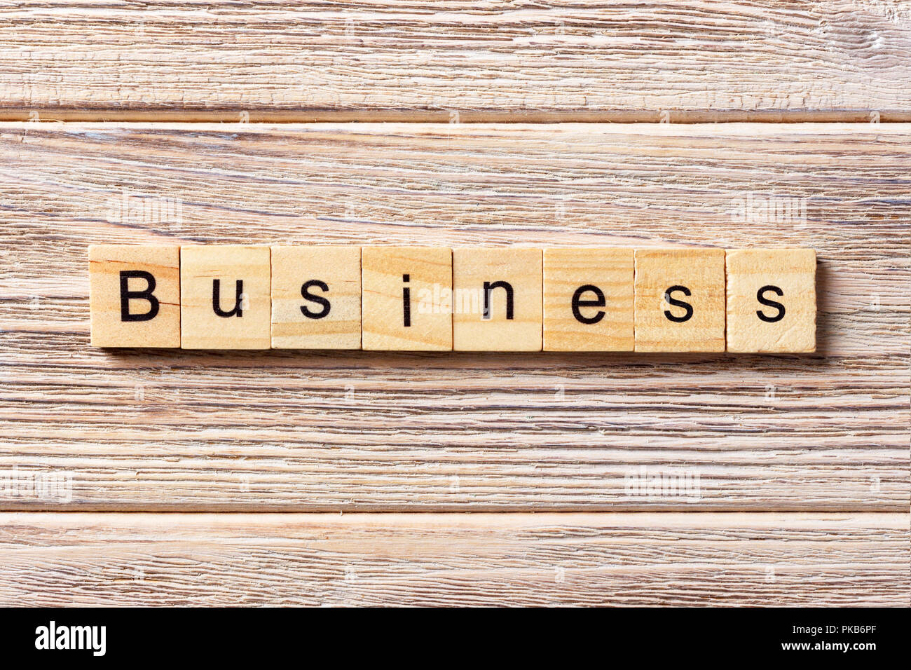 Business word written on wood block. Business text on table, concept ...