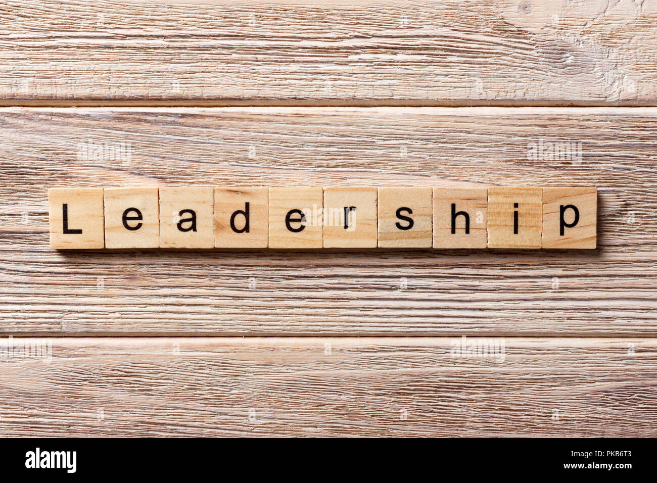 LEADERSHIP word written on wood block. LEADERSHIP text on table ...