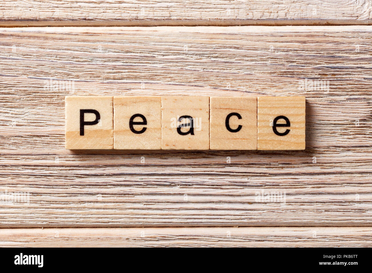 Peace word written on wood block. Peace text on table, concept Stock ...
