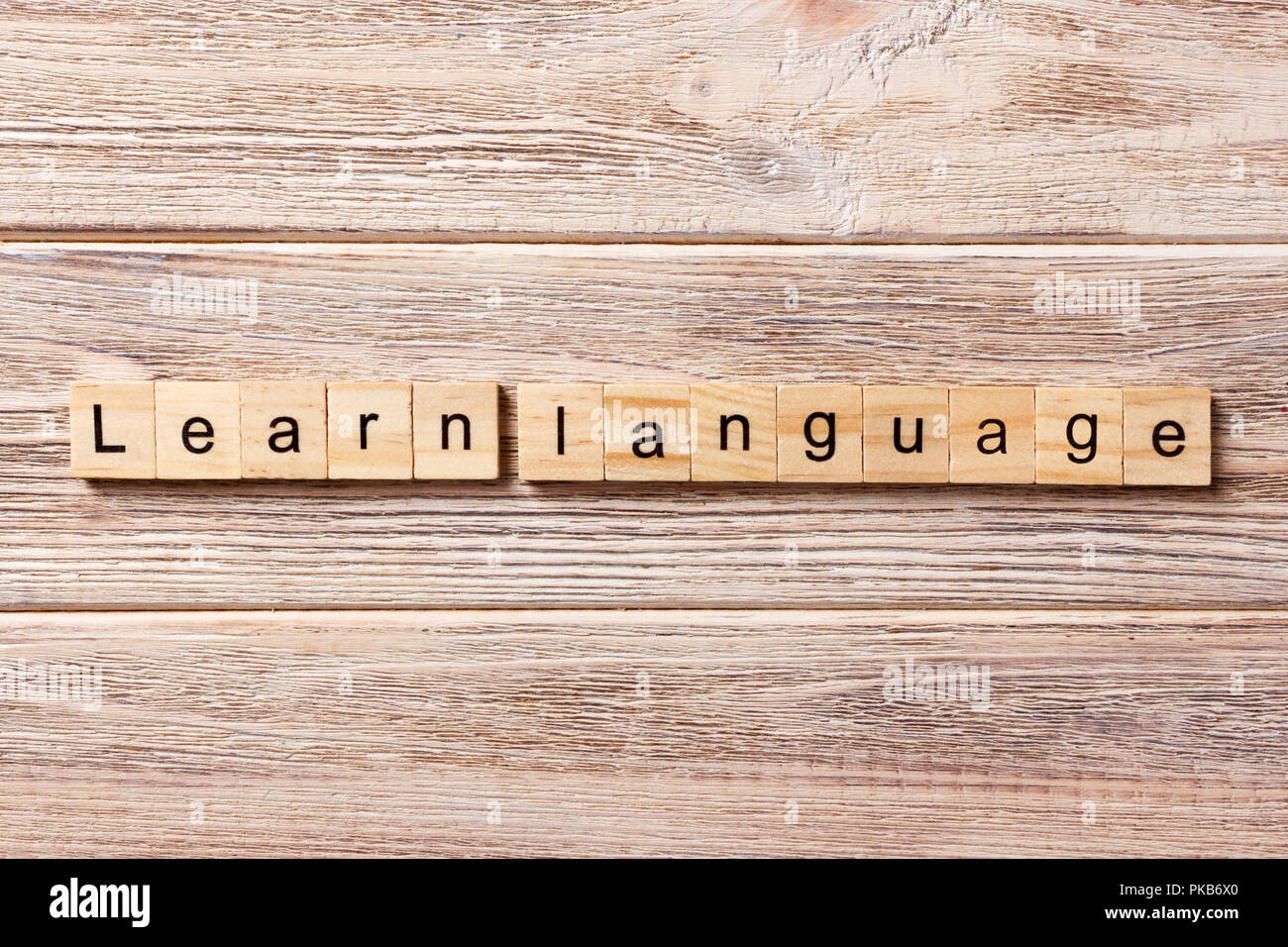 Learn language word written on wood block. Learn language text on table ...