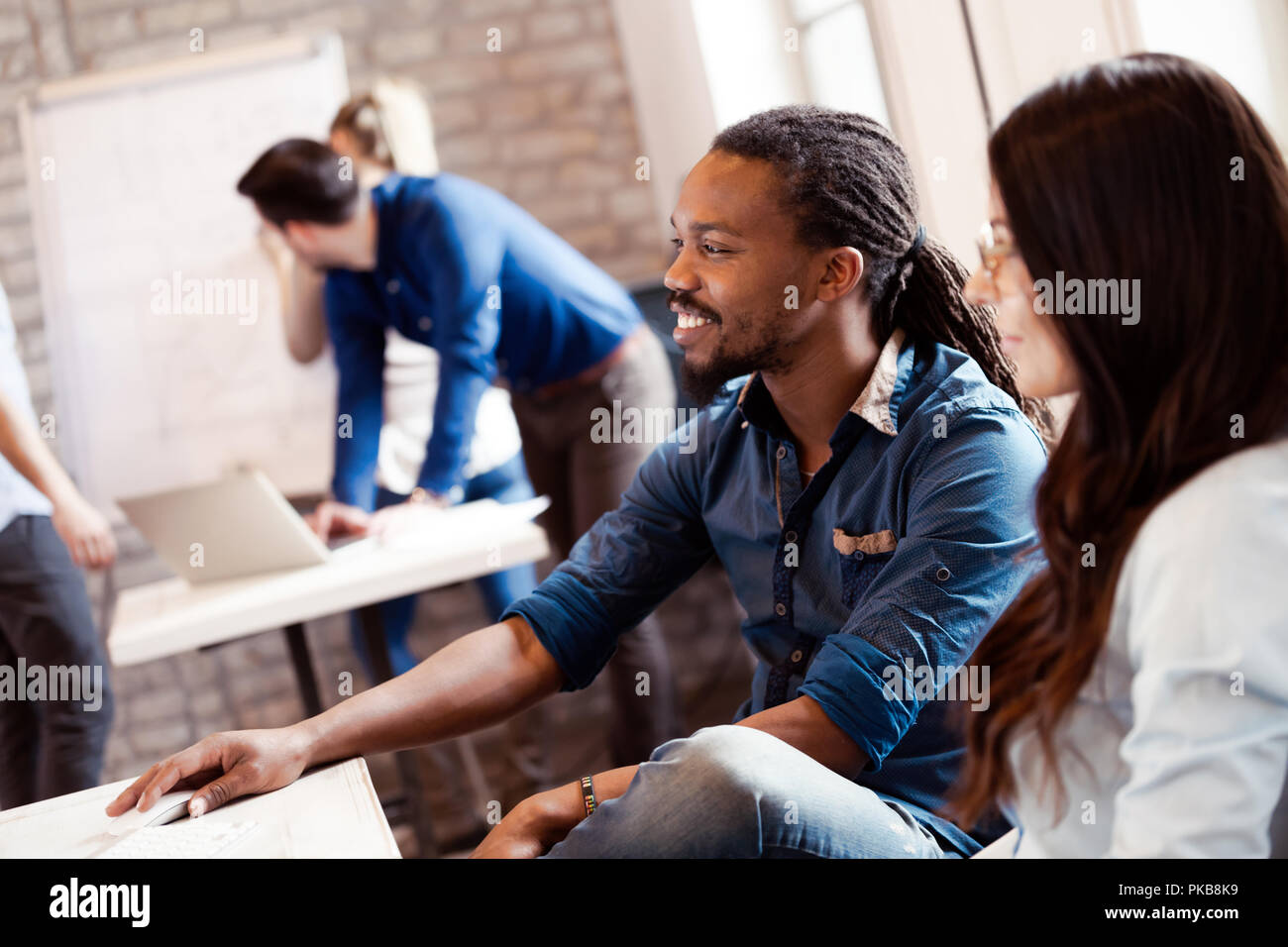 Picture of architects working together in office Stock Photo - Alamy