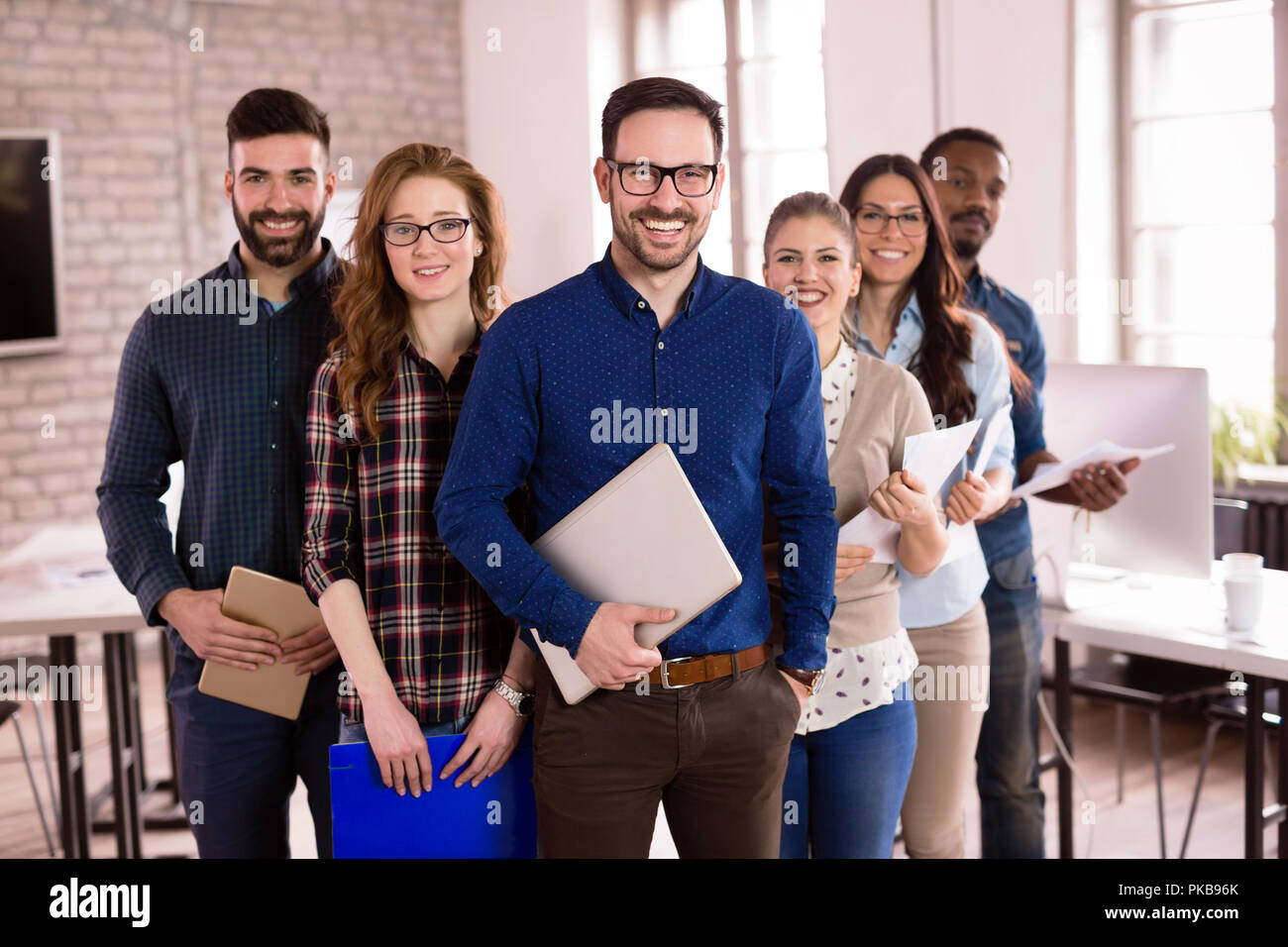 Group young office workers hi-res stock photography and images - Alamy