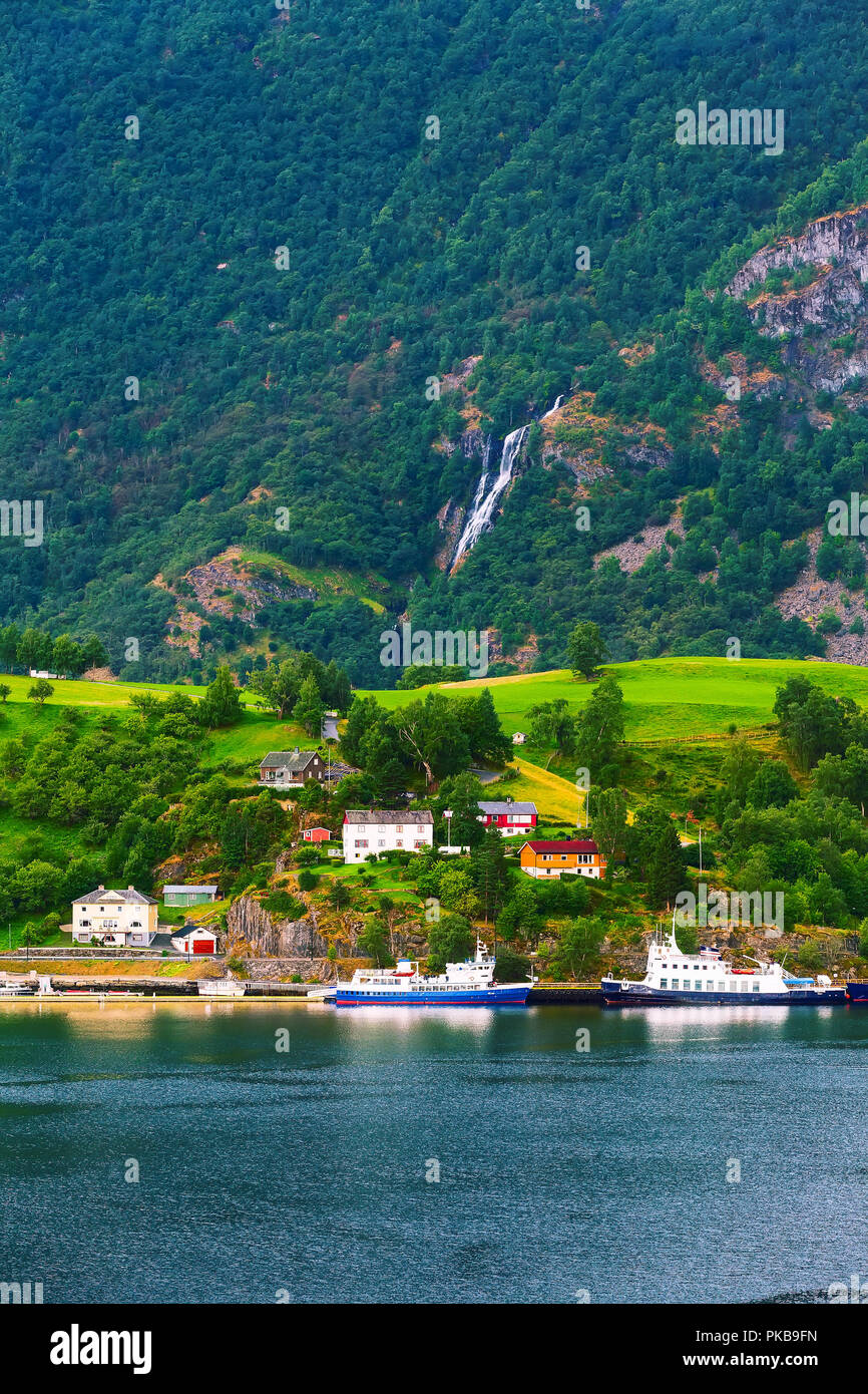 Norwegian village, waterfall and Sognefjord fjord landscape in Flam ...