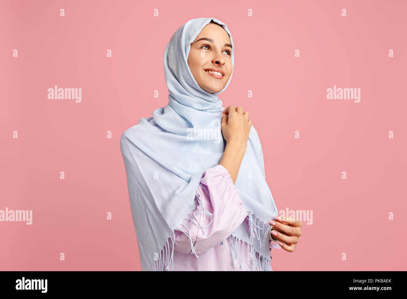 Happy arab woman in hijab. Portrait of smiling girl, posing at pink ...