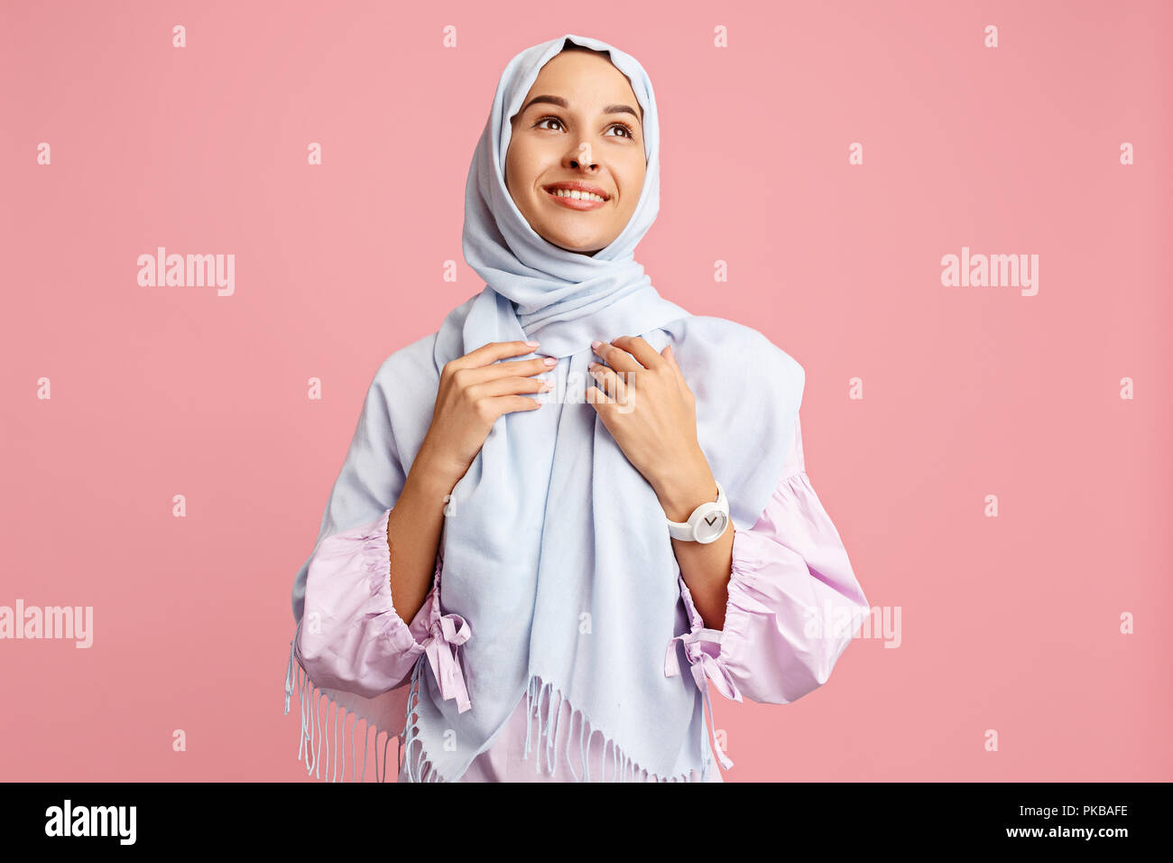 Happy arab woman in hijab. Portrait of smiling girl, posing at pink ...