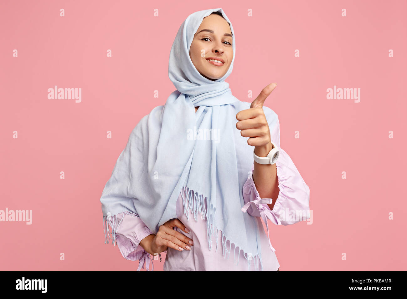 Happy arab woman in hijab pointing to camera. Portrait of smiling girl ...