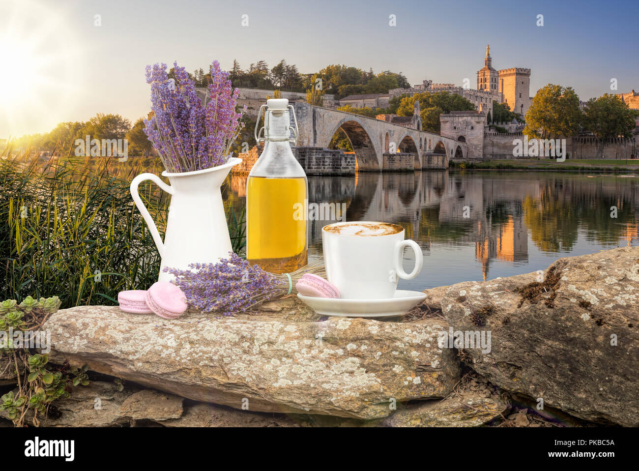 Lavender still life with cup of coffee against Avignon bridge in ...