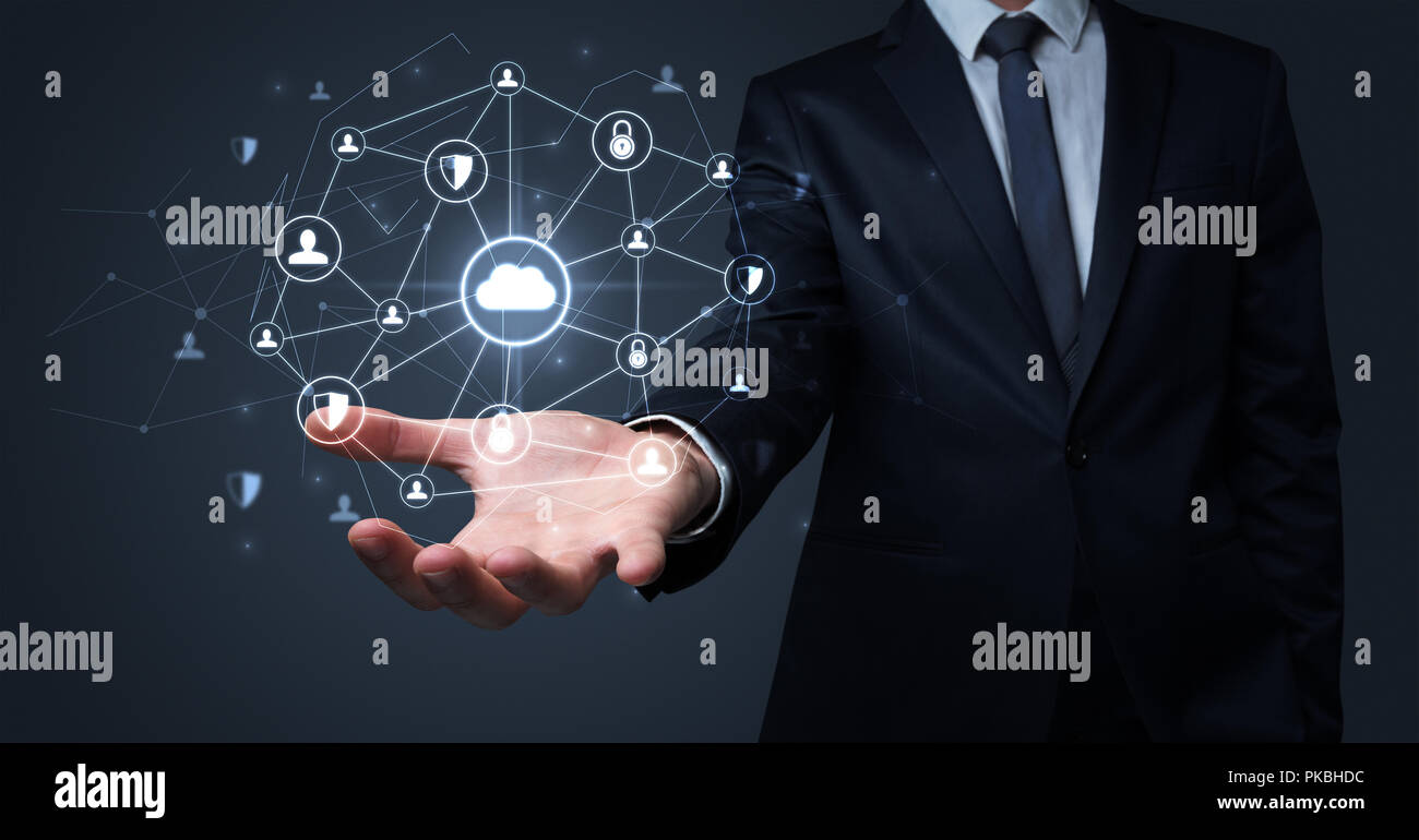 Businessman holding networking connection concept with dark wallpaper ...
