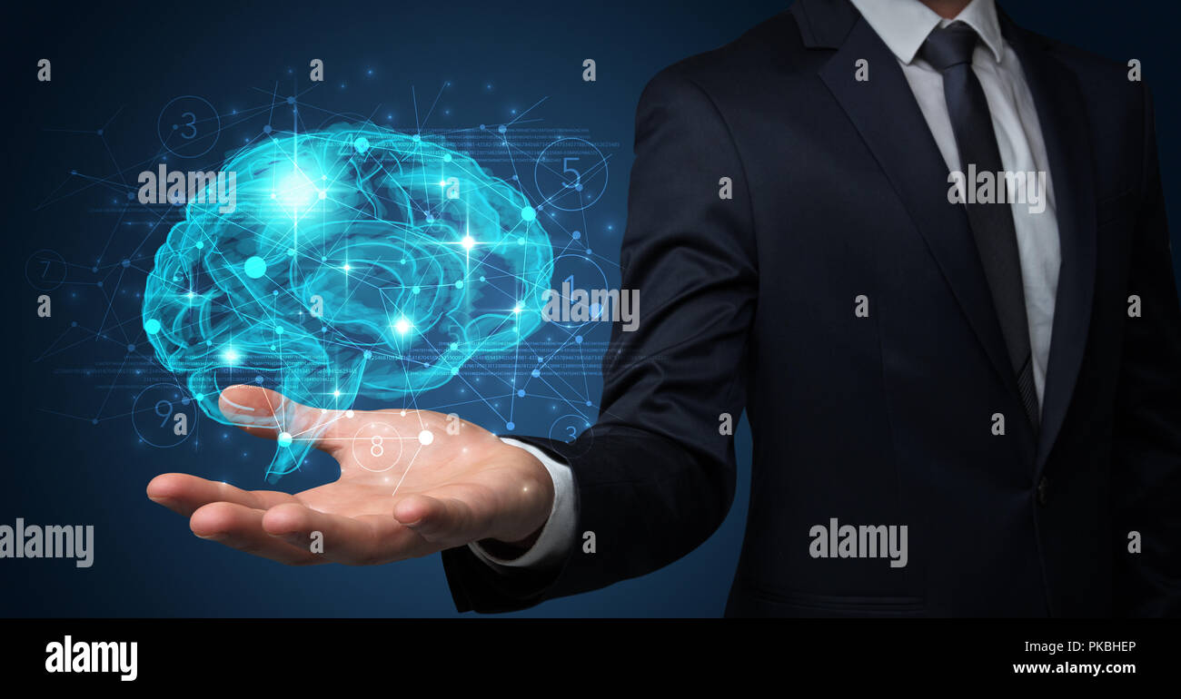 Businessman holding human brain on his hand with logistics symbols ...