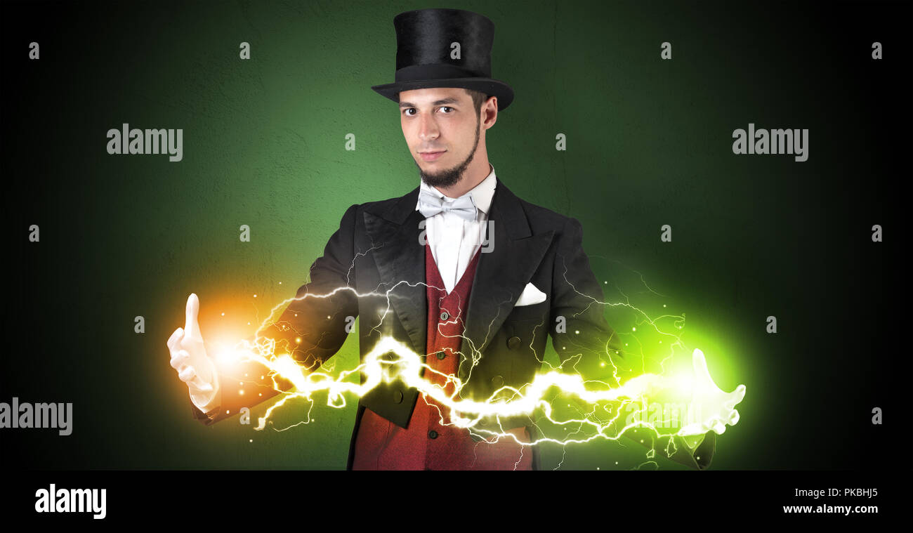 Magician sparkling super power between his two hands Stock Photo - Alamy
