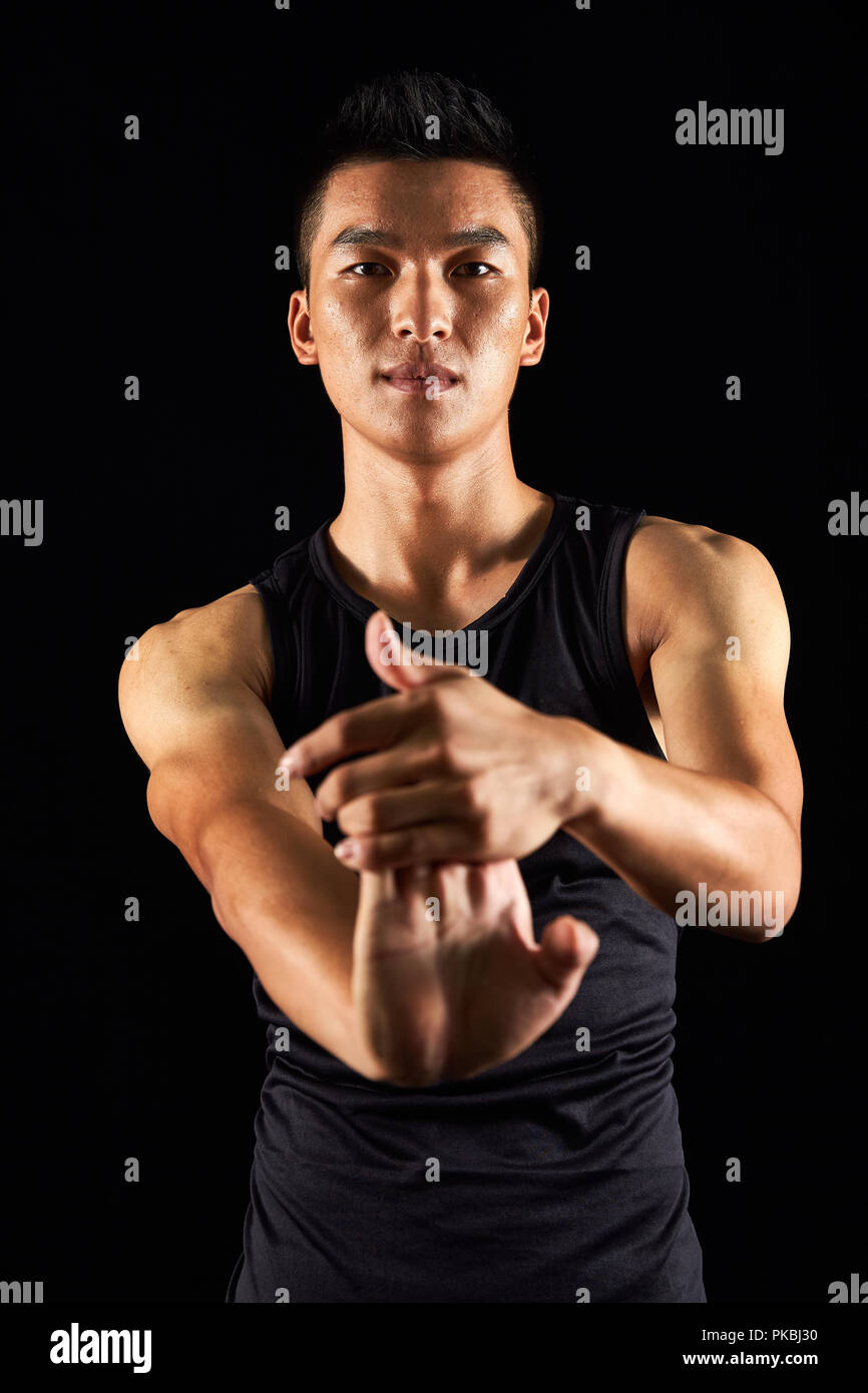 The young men do warm-up exercise Stock Photo - Alamy