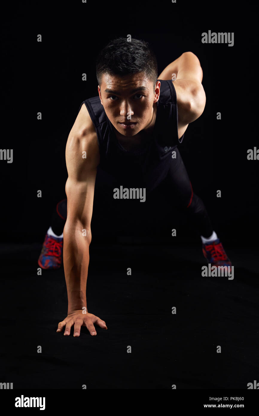 The young man do push-ups in one hand Stock Photo - Alamy