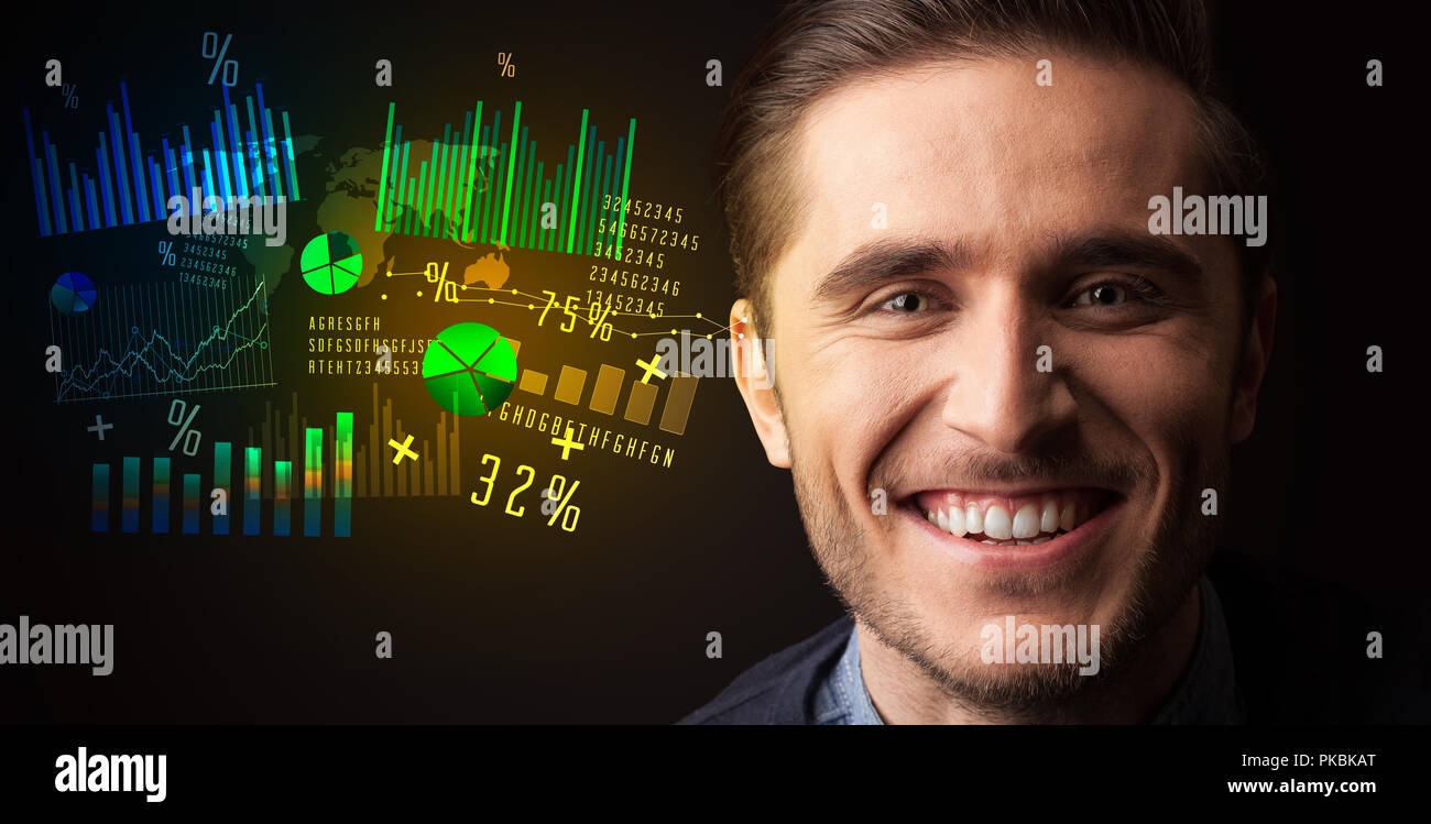 Portrait of a young businessman with colorful charts and graphs next to ...