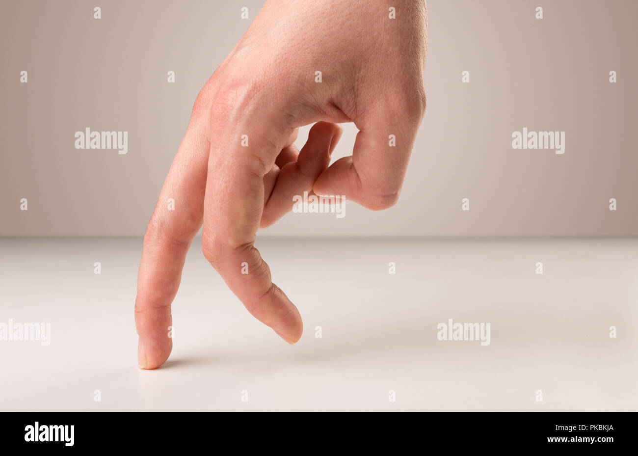 Female fingers walking on white surface Stock Photo - Alamy