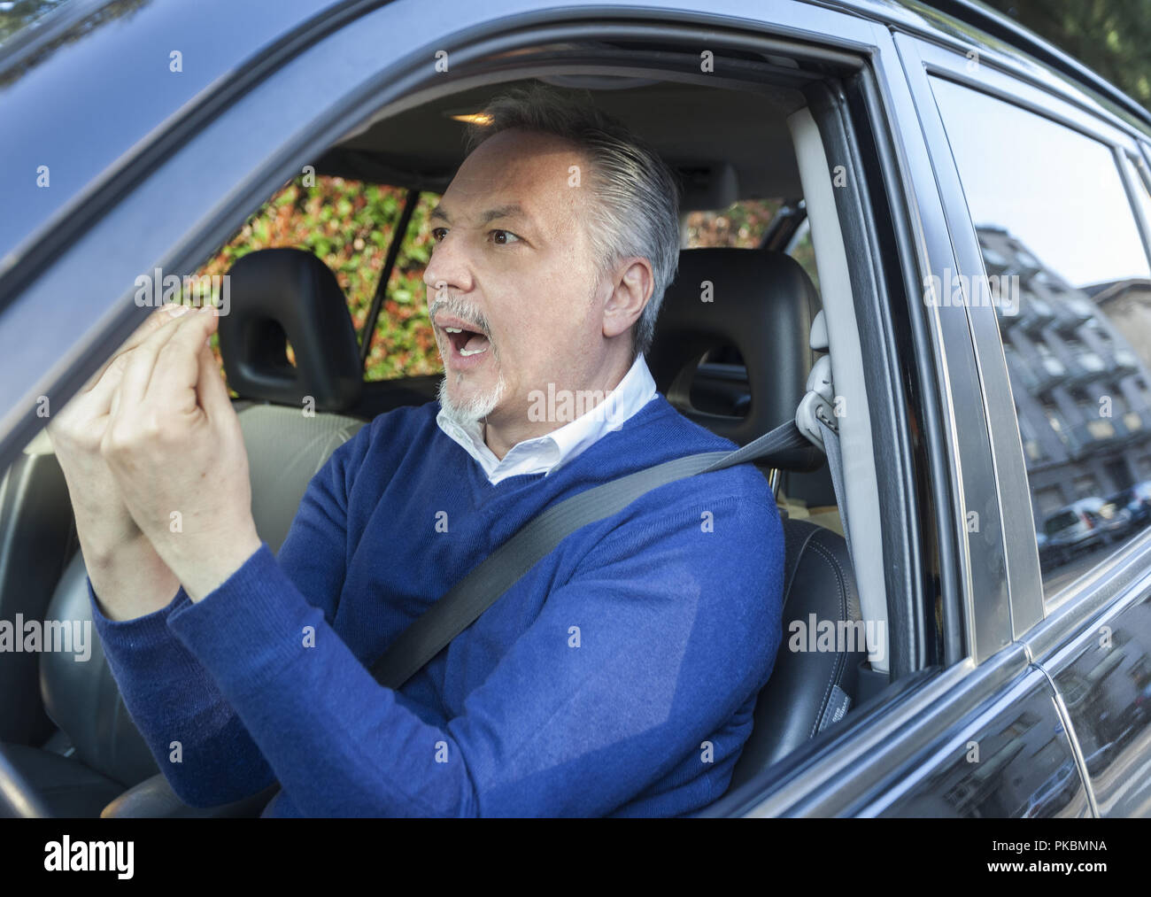 Portrait of an angry driver yelling in his car Stock Photo - Alamy