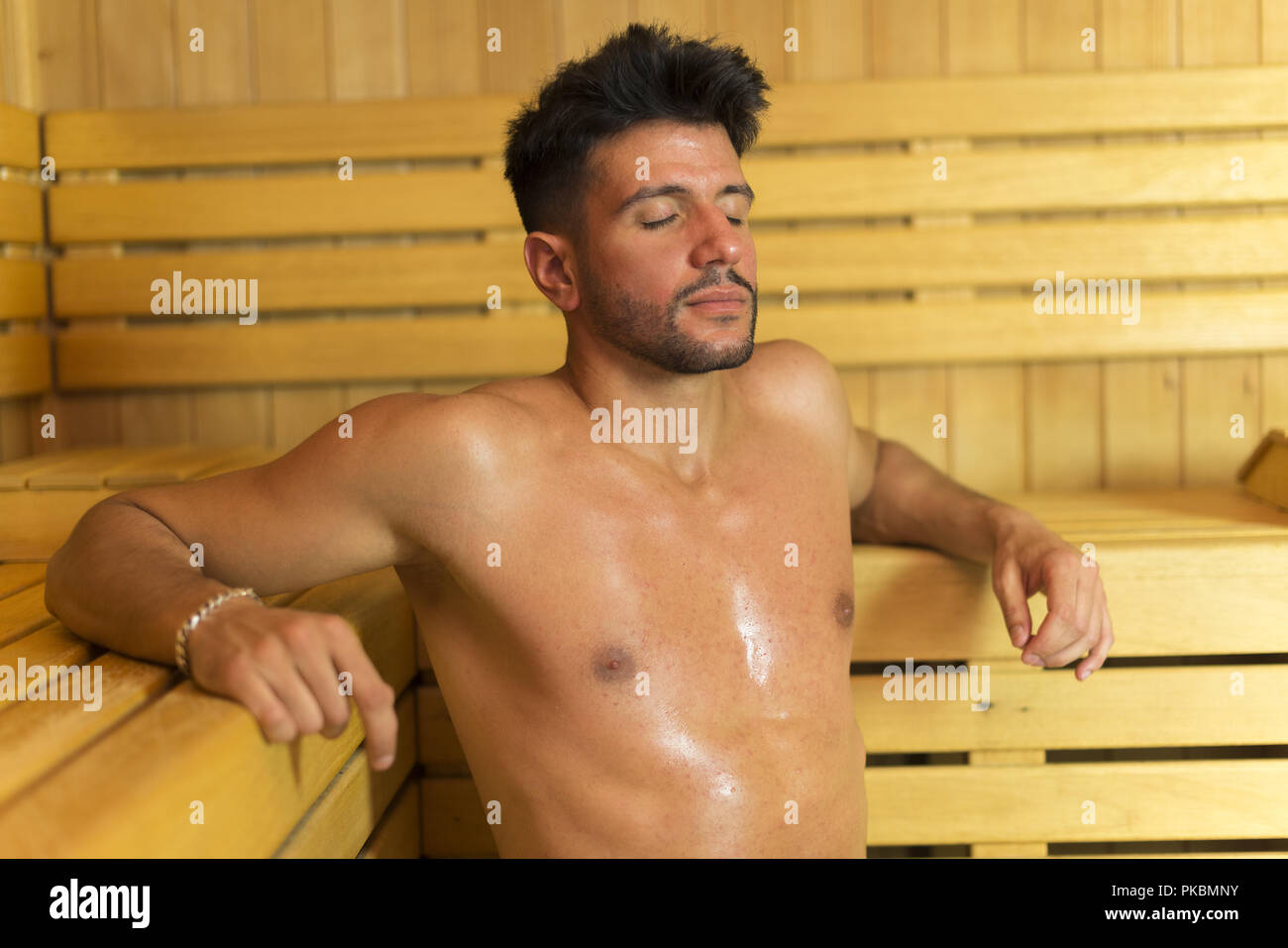 Smiling man having a sauna bath in a steam room Stock Photo - Alamy
