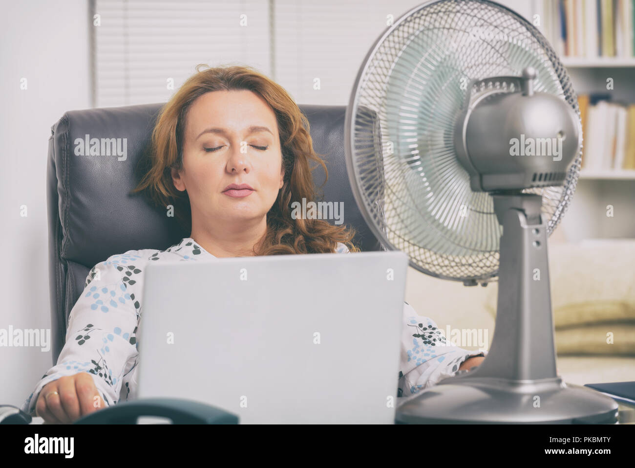 Person cooling fan hi-res stock photography and images - Alamy