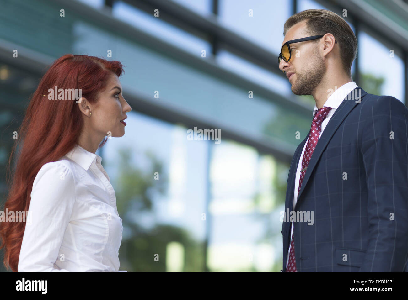 Business people talking to each other Stock Photo - Alamy