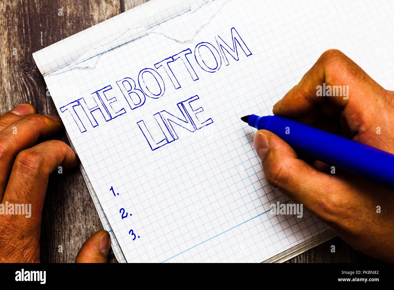 Handwriting text writing The Bottom Line. Concept meaning asking ...