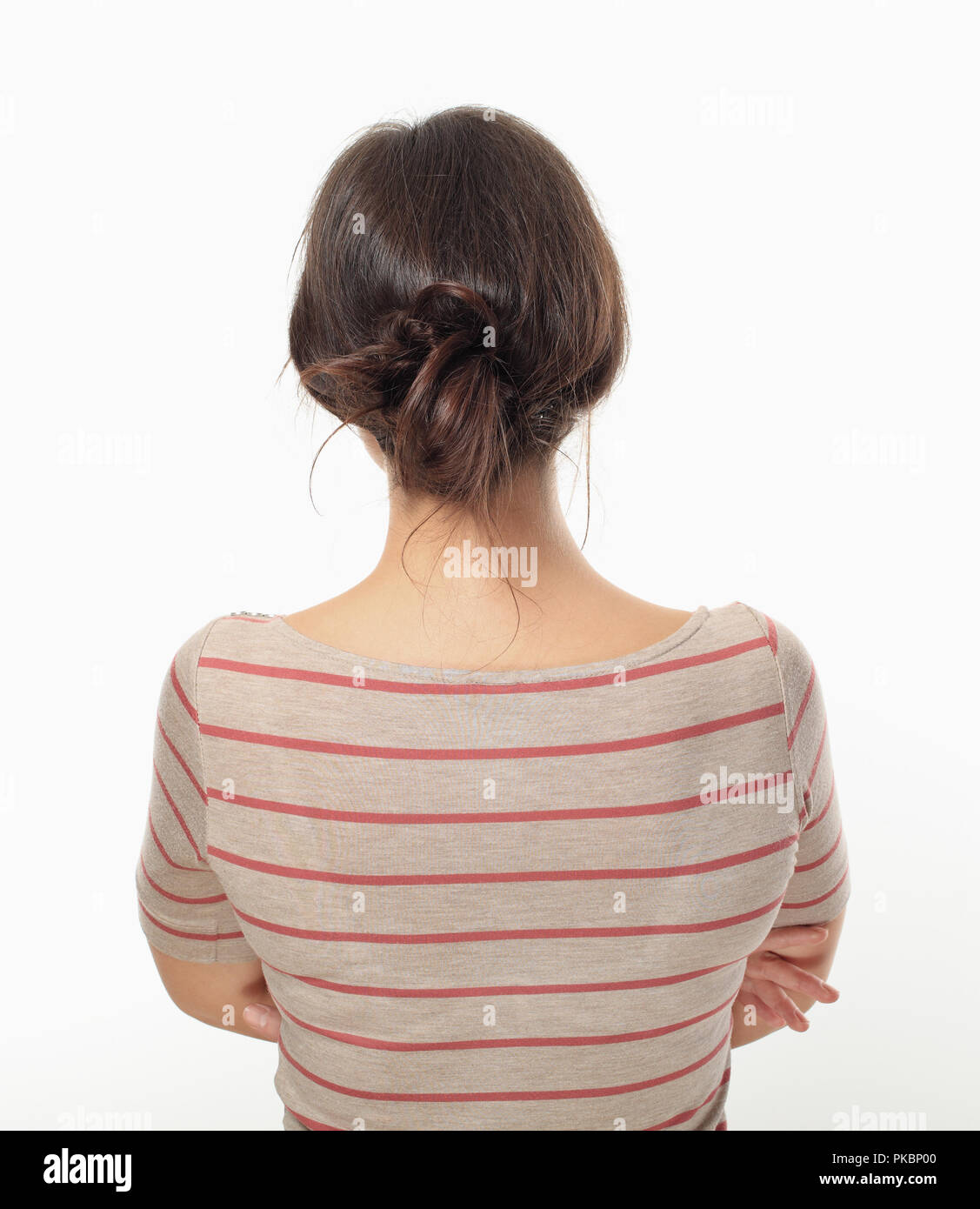 Brunette woman standing back to camera Stock Photo - Alamy