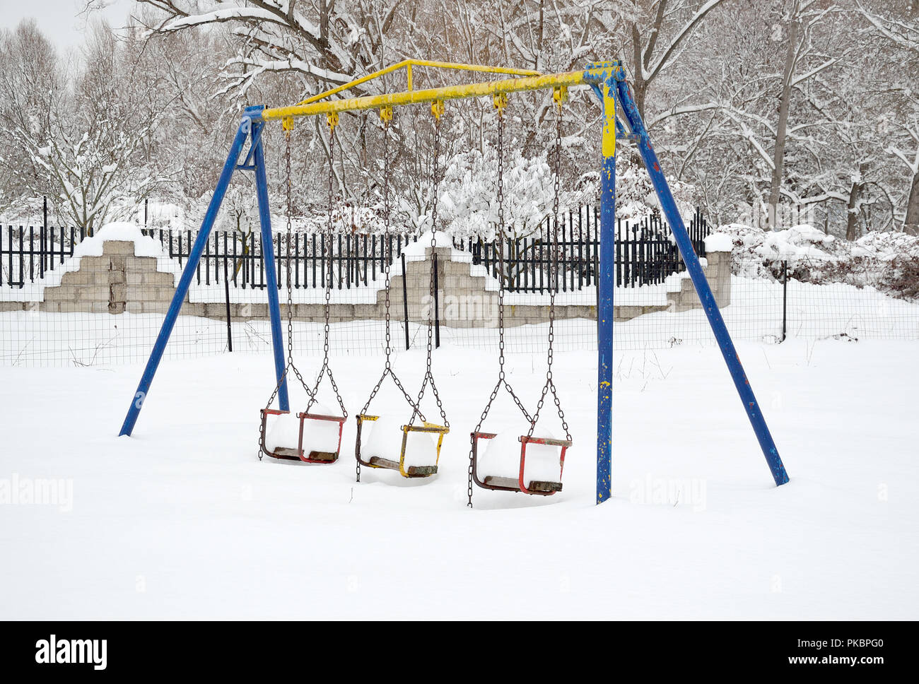 Swings covered with white ,pure snow Stock Photo - Alamy