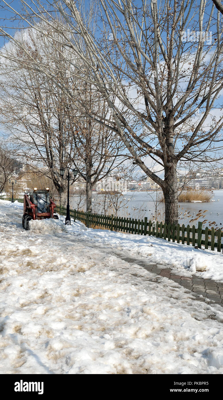 Man removes snow ice hi-res stock photography and images - Alamy